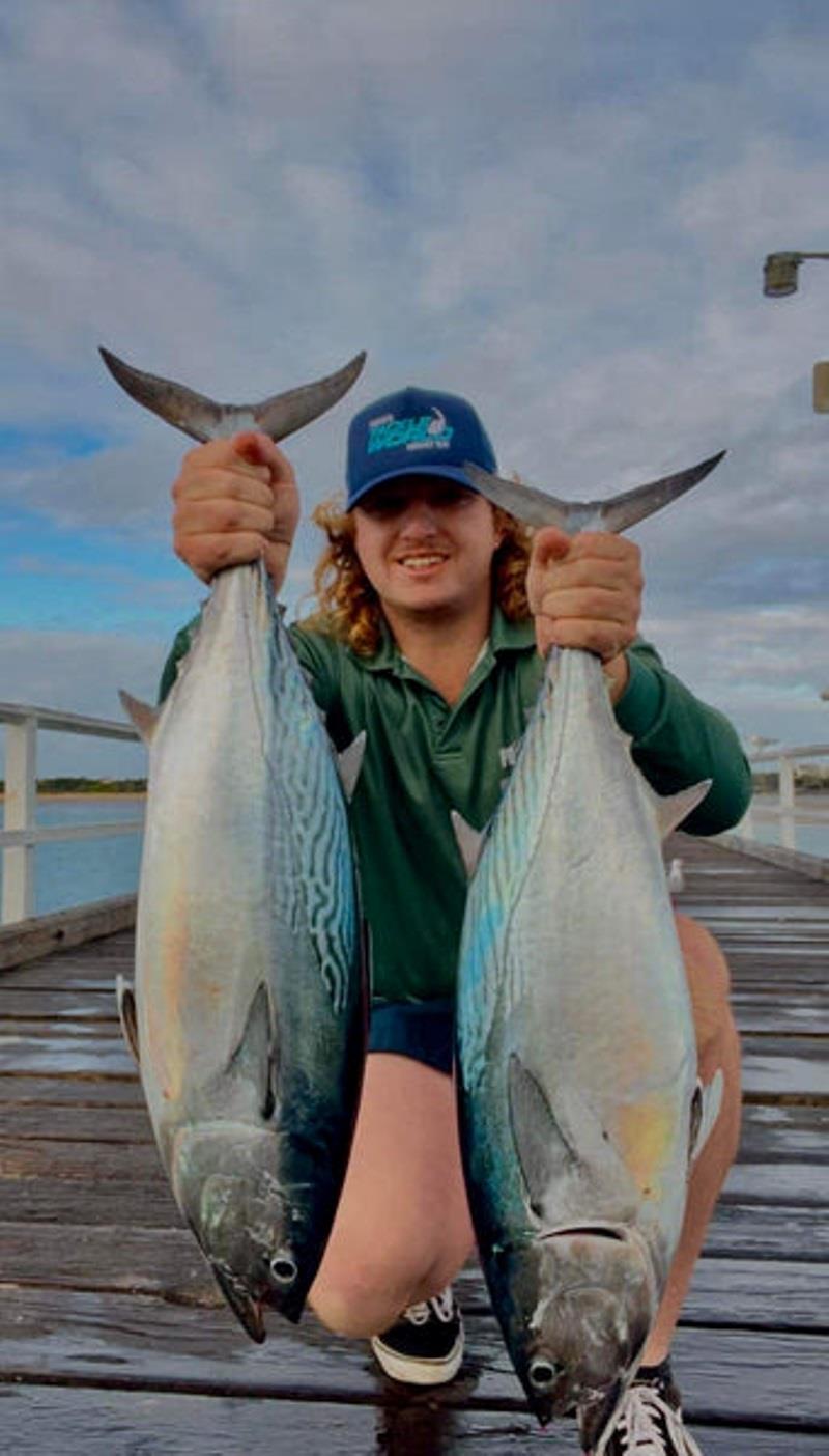 Local lad Tom with two hands full of Urangan Pier mack tuna. Be ready ...
