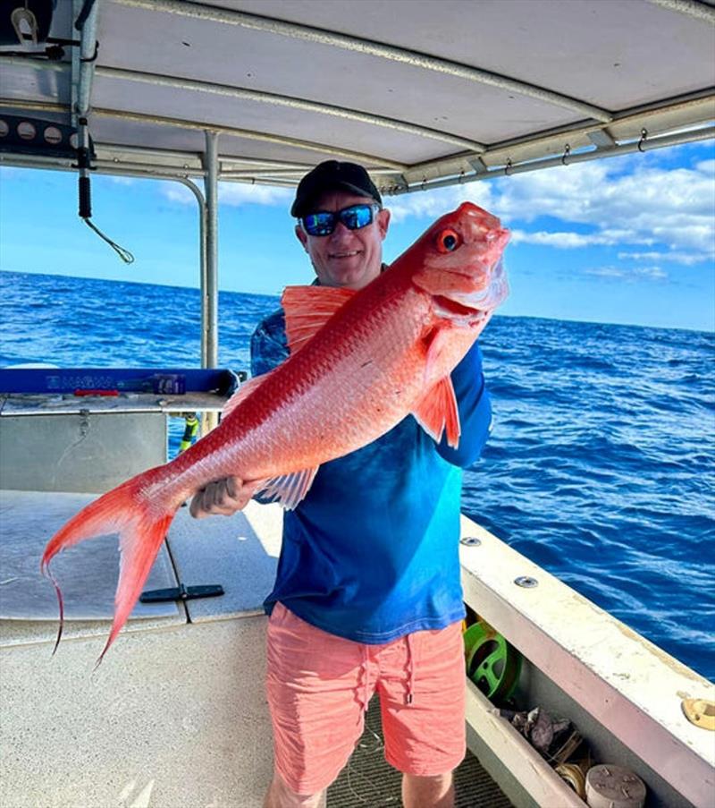 Leighton with one of several flametail snapper from a trip out with ...