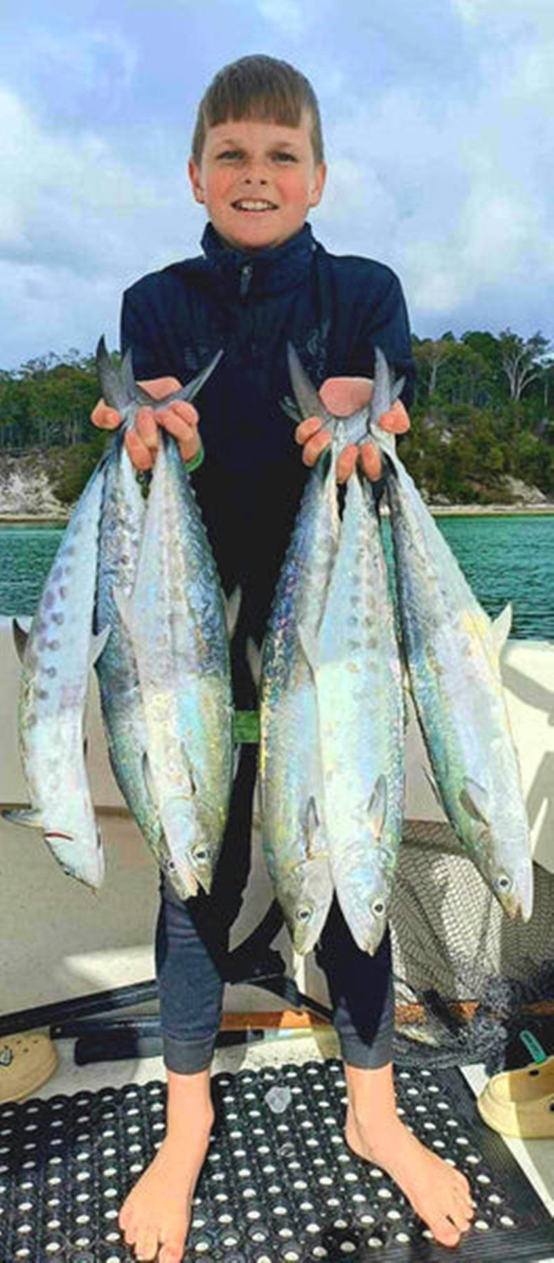 This young bloke's got his hands full with this brace of school ...