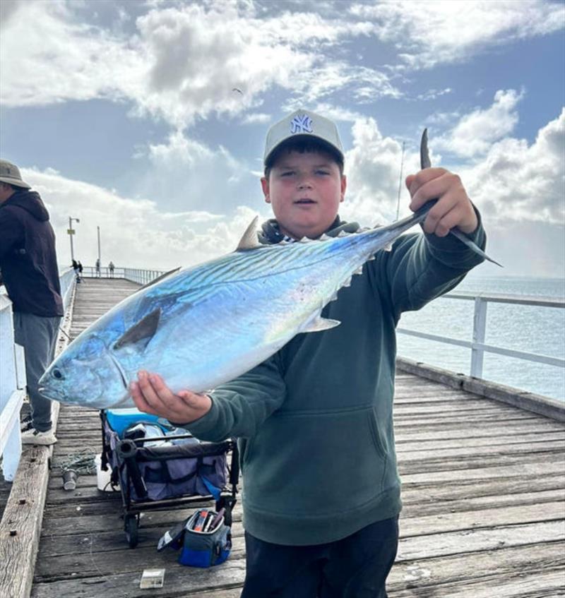 Young Mason Armstrong with a mack tuna he caught from the pier recently ...