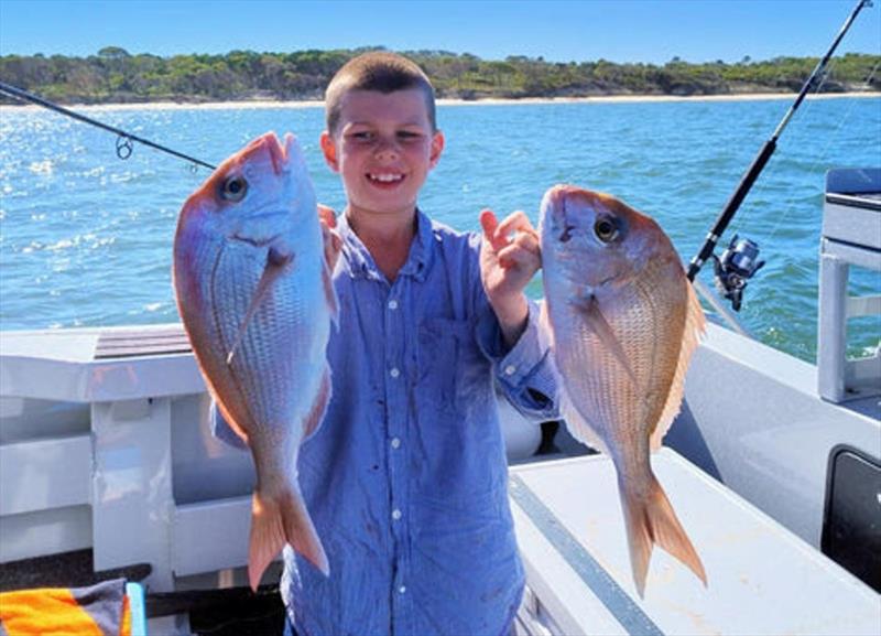 Kade showing the family how it's done, with a couple of tasty squire ...