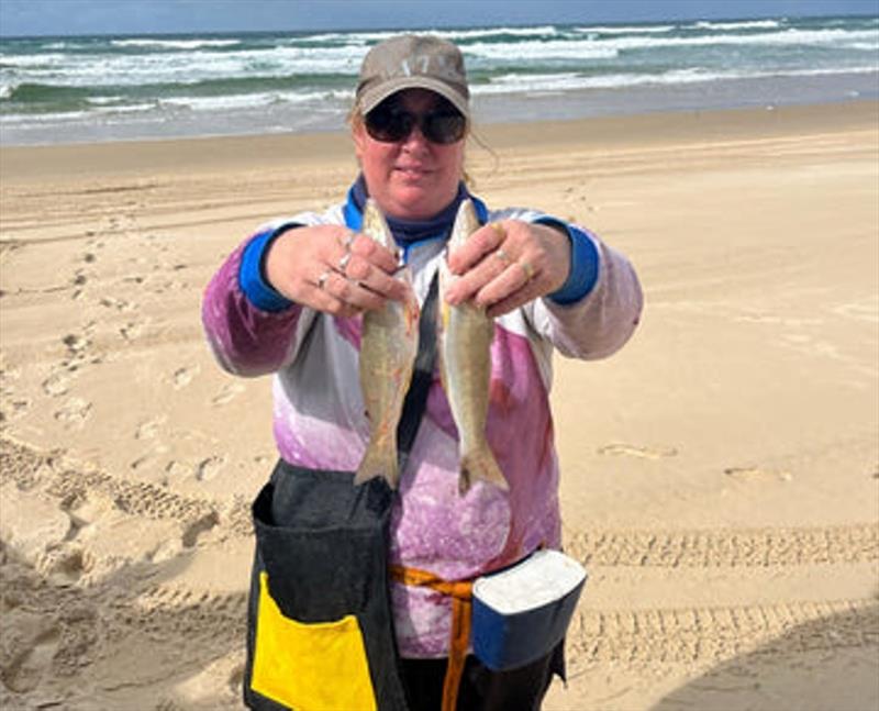 Chris' better half with some fine whiting from a shallow gutter on ...
