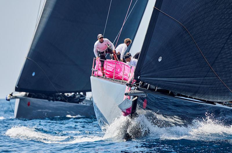 Jethou's bow team prepares to hoist their yacht's famous fuchsia ...