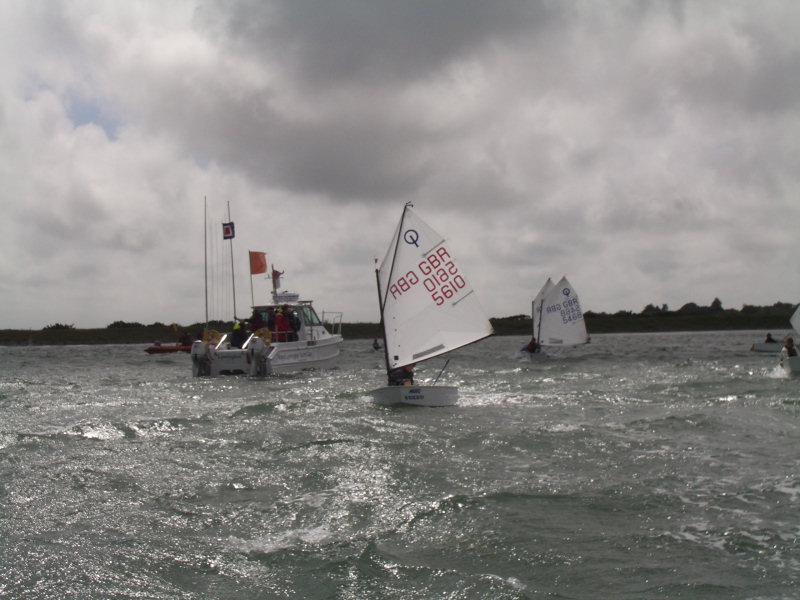 Heavy downpours and gusts of well over 20 knots for the Harken Optimist regatta fleet open at ...