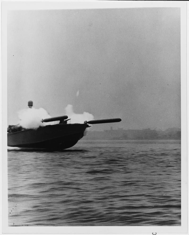An 80-foot Elco PT boat launches a salvo of torpedoes