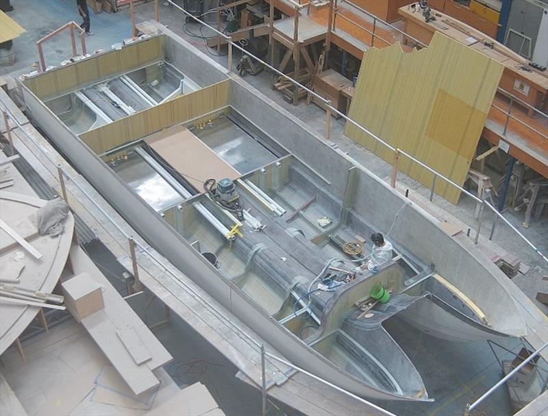 Hull right side up and with bulkhead and systems fit out underway - B73