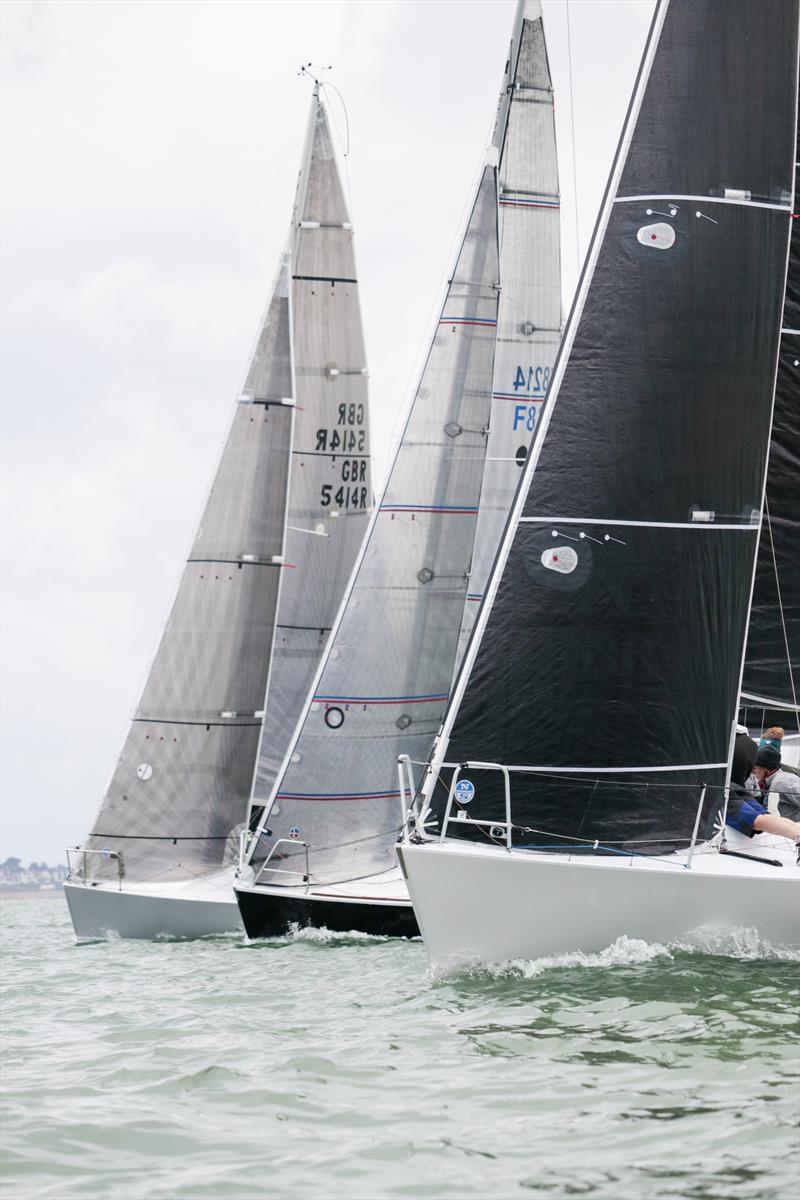 The fleet line up for a race start on day 1 of the Quarter Ton Cup