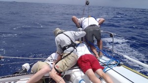 All heads to the task of attaching a rudder.