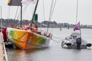 The Team Sanya shore crew work on repairing delamination from the hull ...