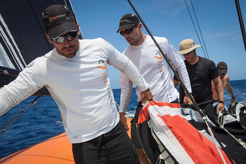 Mark Towill, Stu Bannatyne, and Jesse Fielding work together to drag ...