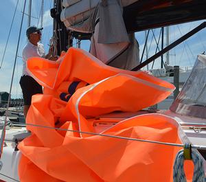 Preparations before the start. Crewman on yacht ODETTE check ingout ...