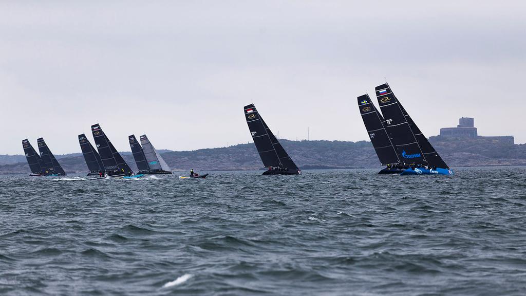 The RC44 fleet practice racing against the backdrop of the fortress ...