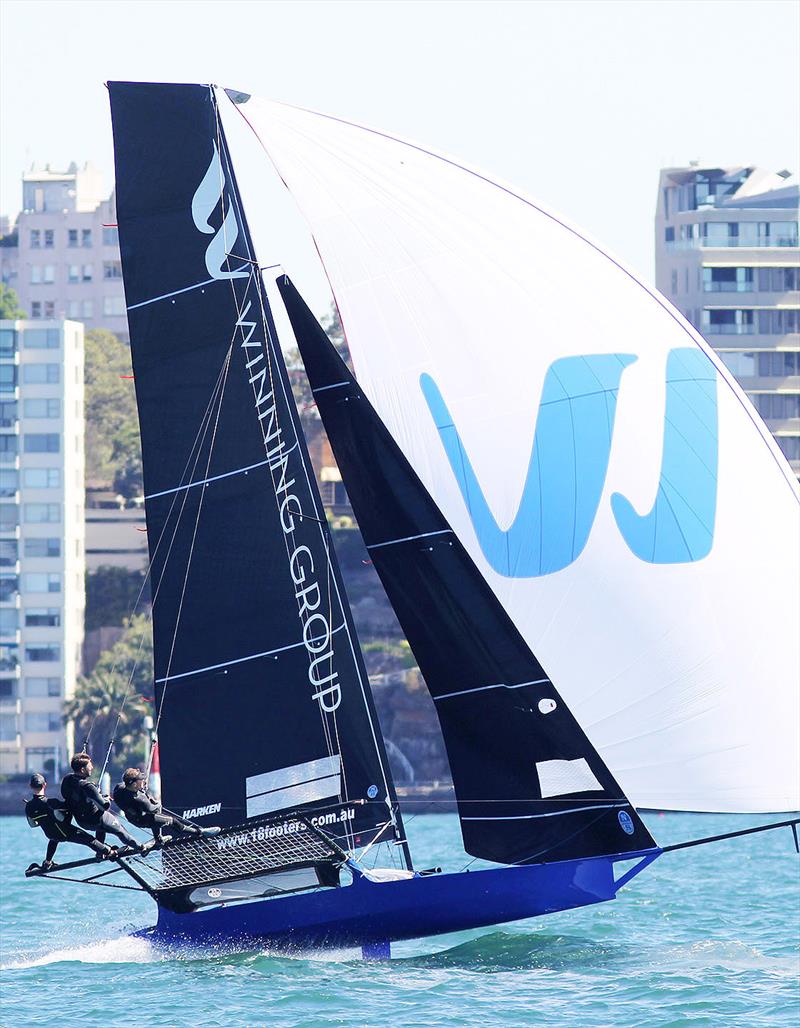 Winning Group's crew drive the skiff hard on the first spinnaker run to ...
