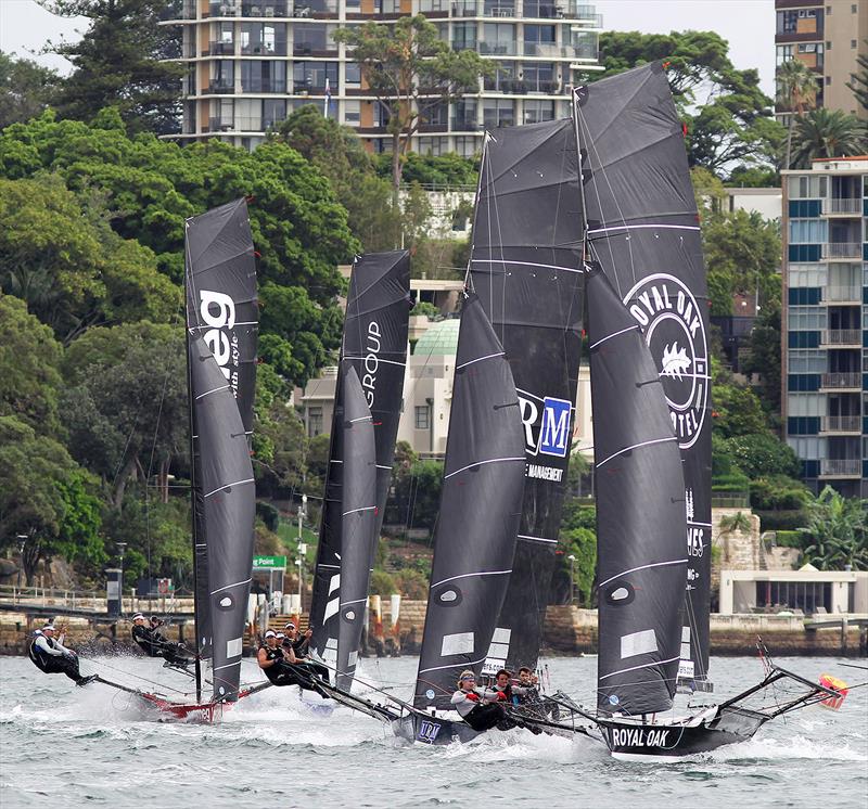 The charge of the challengers after rounding the first windward mark ...