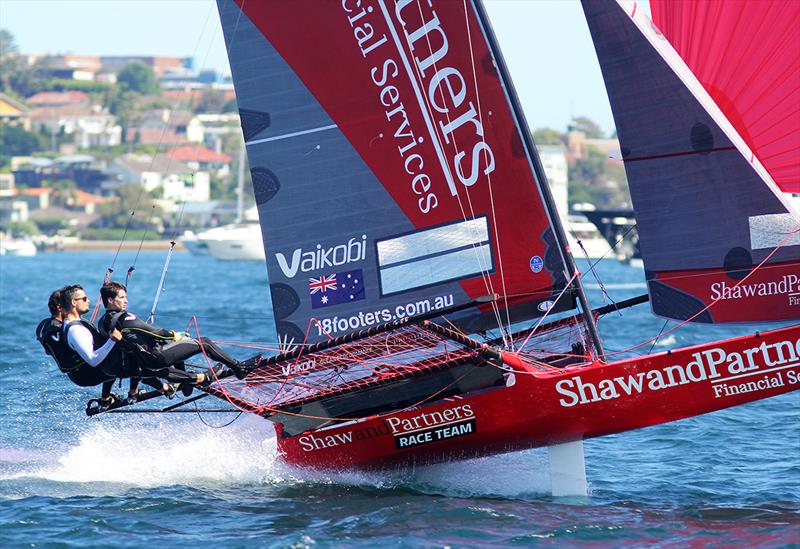 Shaw and Partners crew drive the skiff hard down the second lap ...