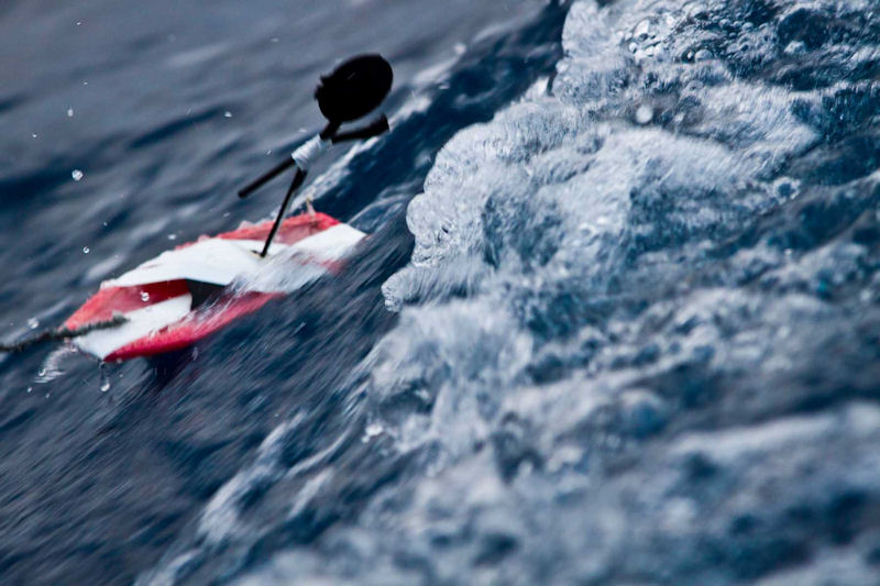 Ryan Godfrey's surfer invention takes to the stern wave during some ...